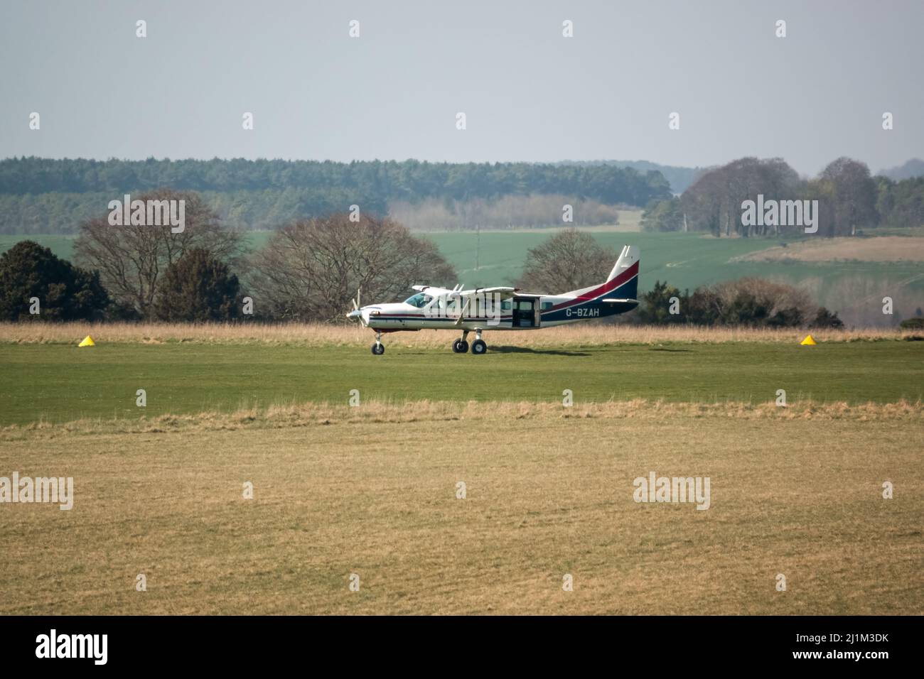 Cessna 208b Grand Caravan G-BZAH light aircraft descends to land and ...