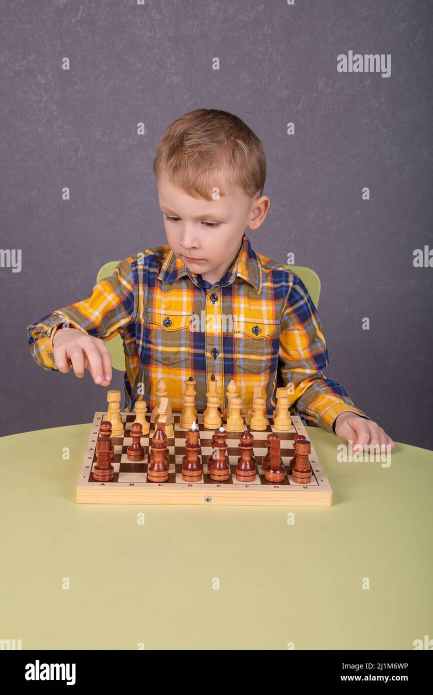 a little boy is playing chess Stock Photo - Alamy