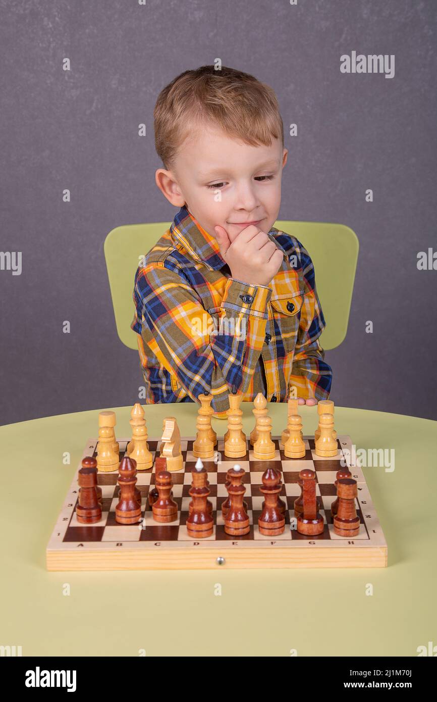 a little boy is playing chess Stock Photo - Alamy