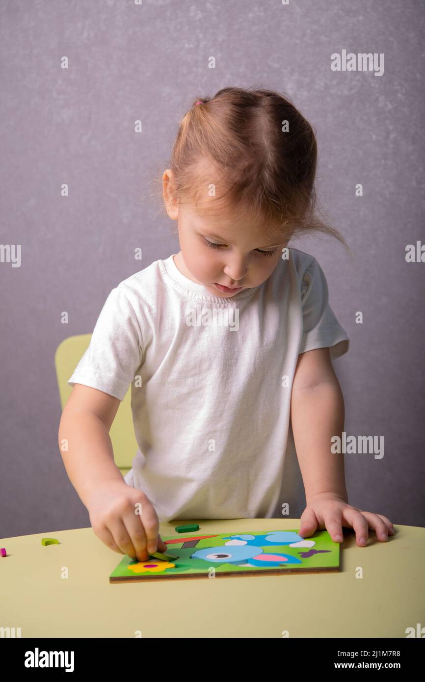 Girl and puzzle hi-res stock photography and images - Alamy