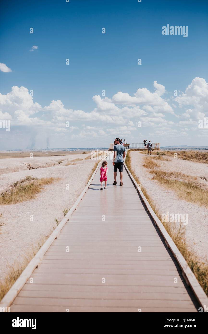 Dad and daughter walk to lookout point Badlands National Park, SD Stock ...