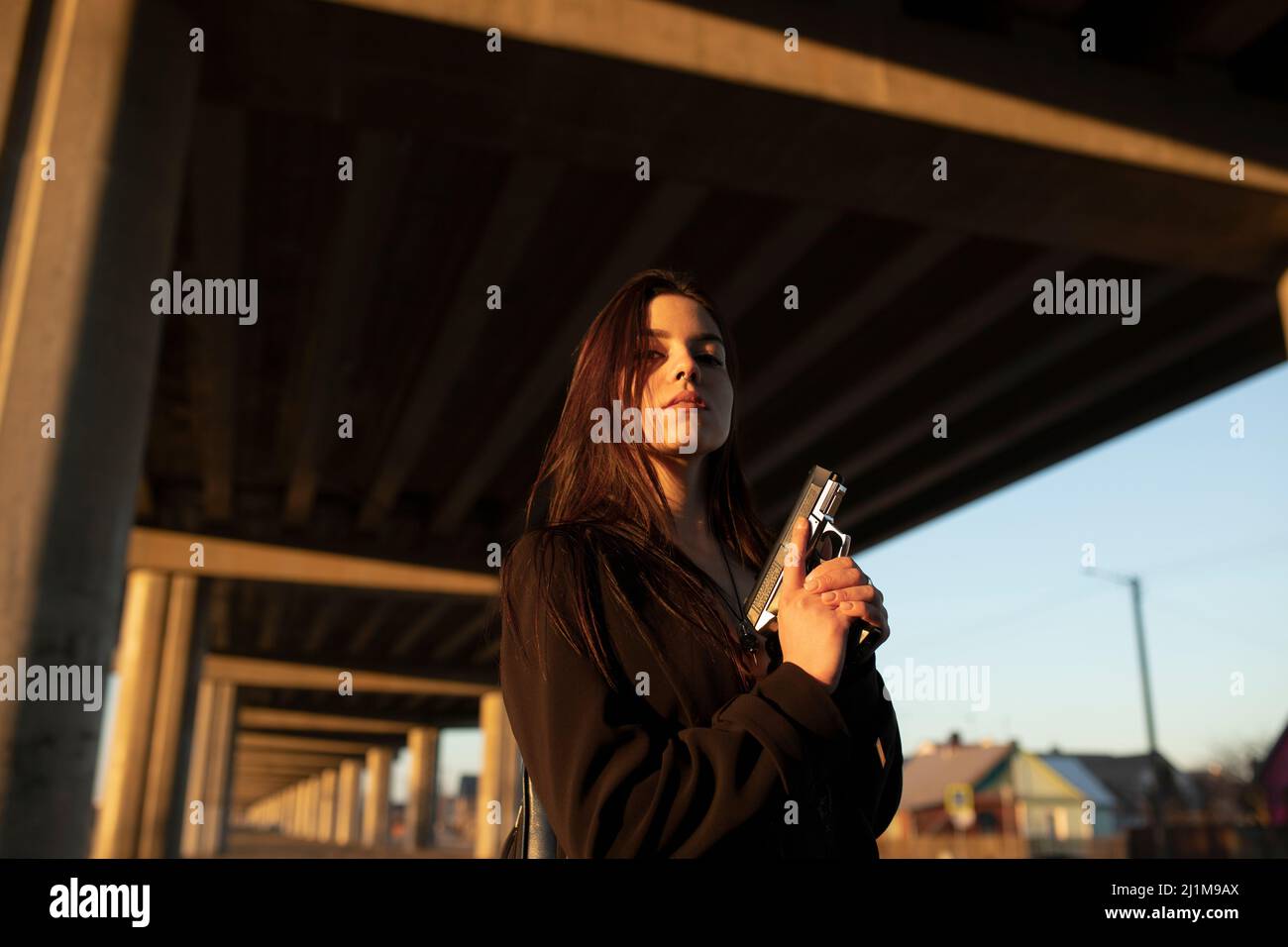 Woman gun suit hi-res stock photography and images - Alamy