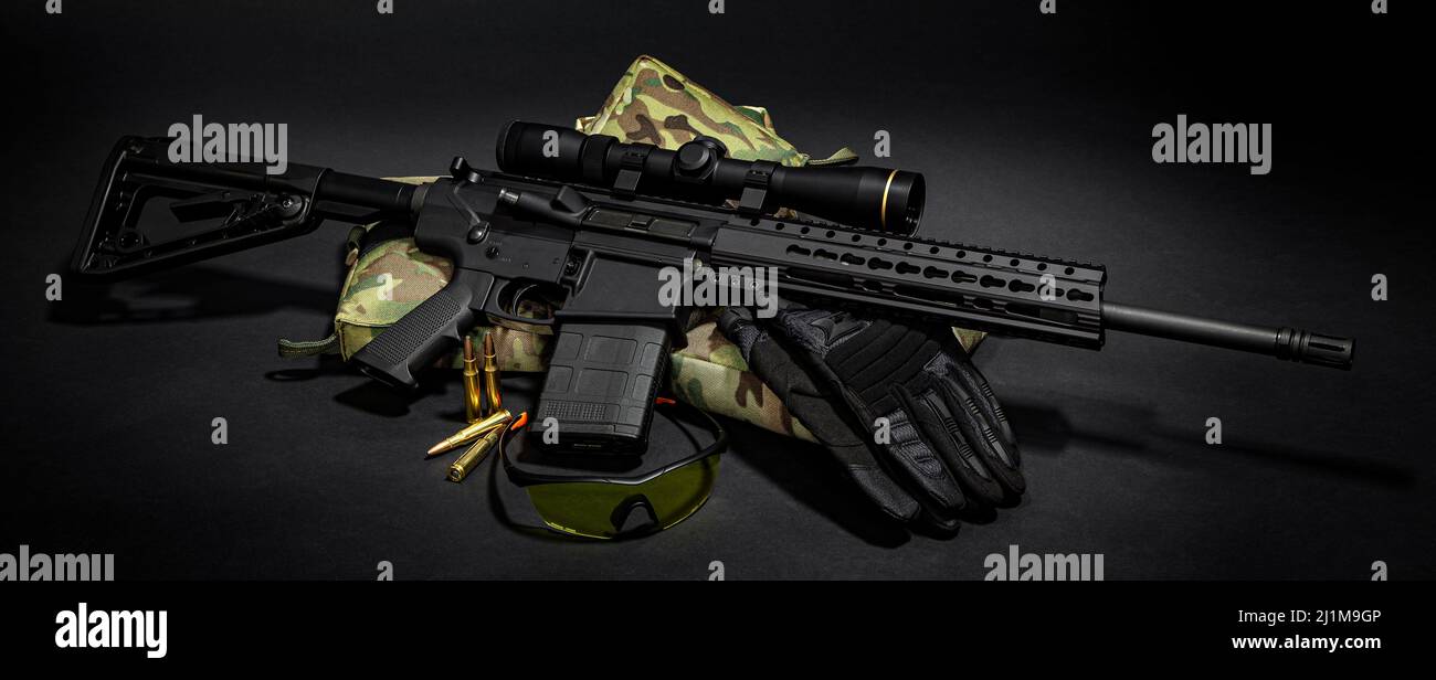 Modern automatic carbine with optical sight. Tactical goggles ...