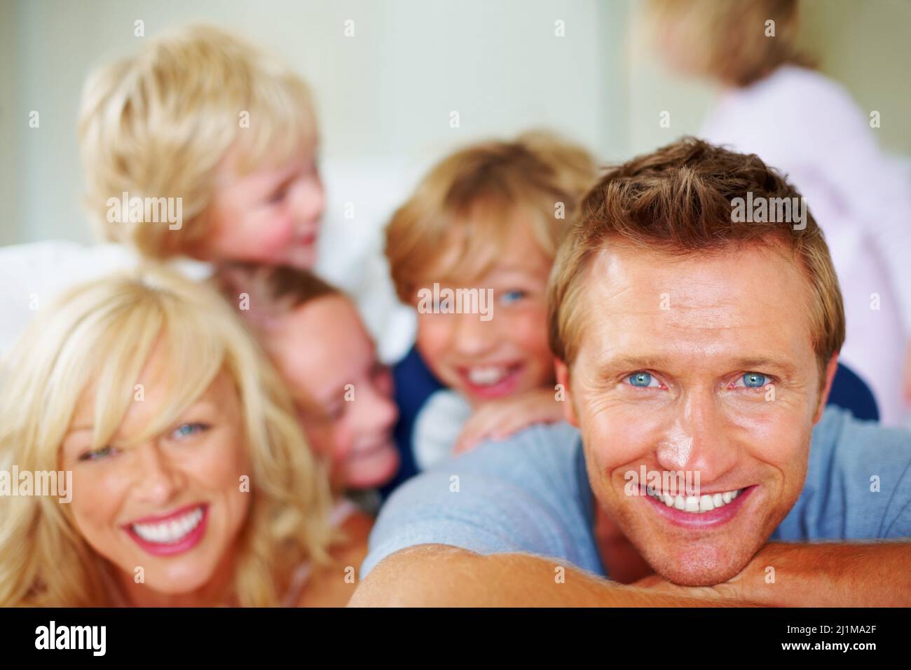 Happy mature man with his family enjoying together. Portrait of a happy ...