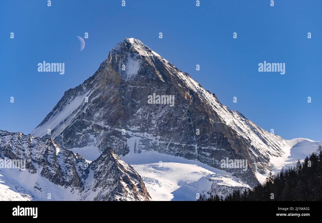 The mount Everest covered with a snow in a winter season and the moon ...