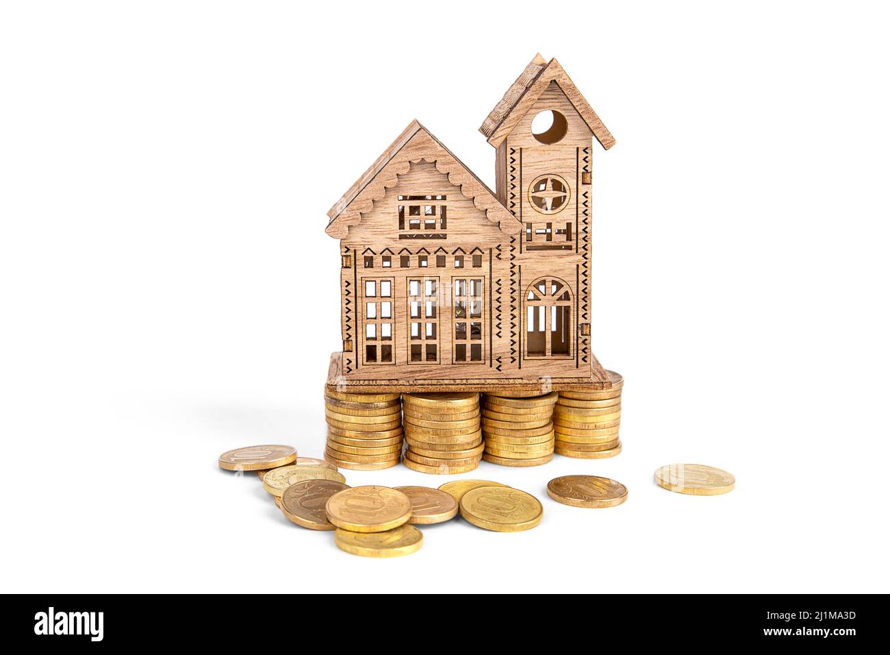 Wooden house on stacks of coins on a white background Stock Photo - Alamy