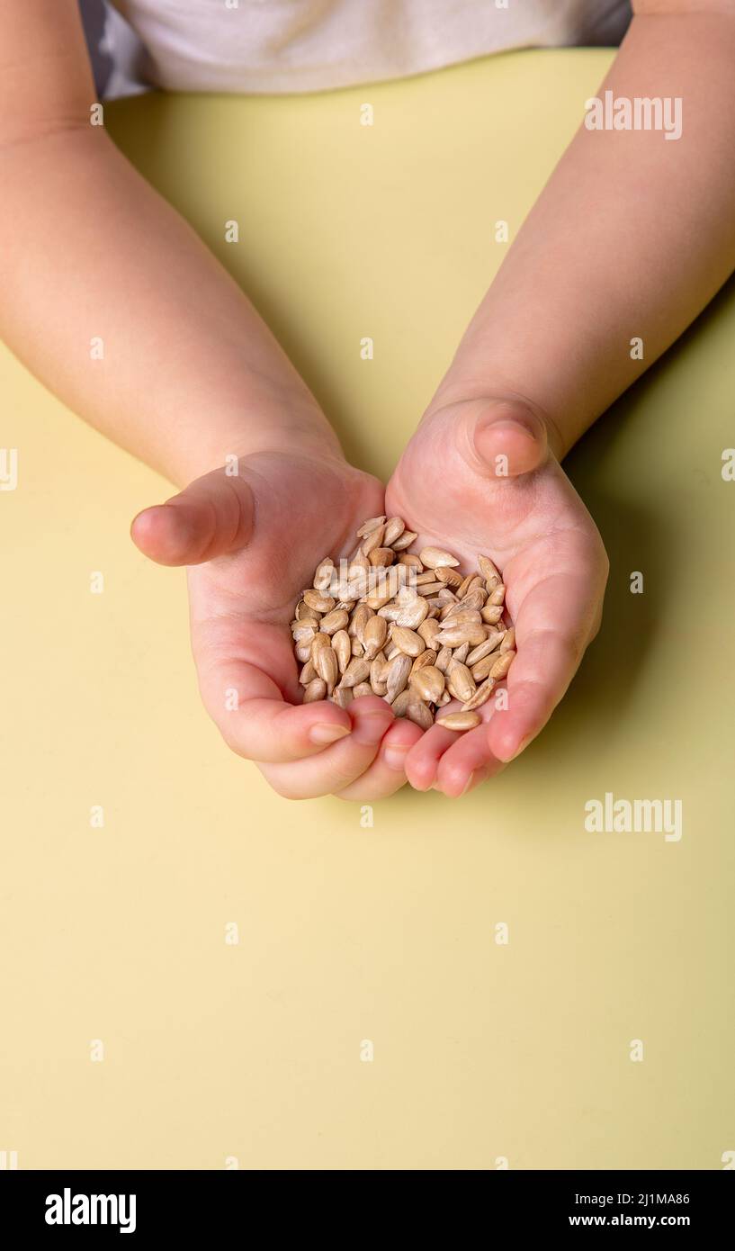 Children hands seeds hi-res stock photography and images - Alamy