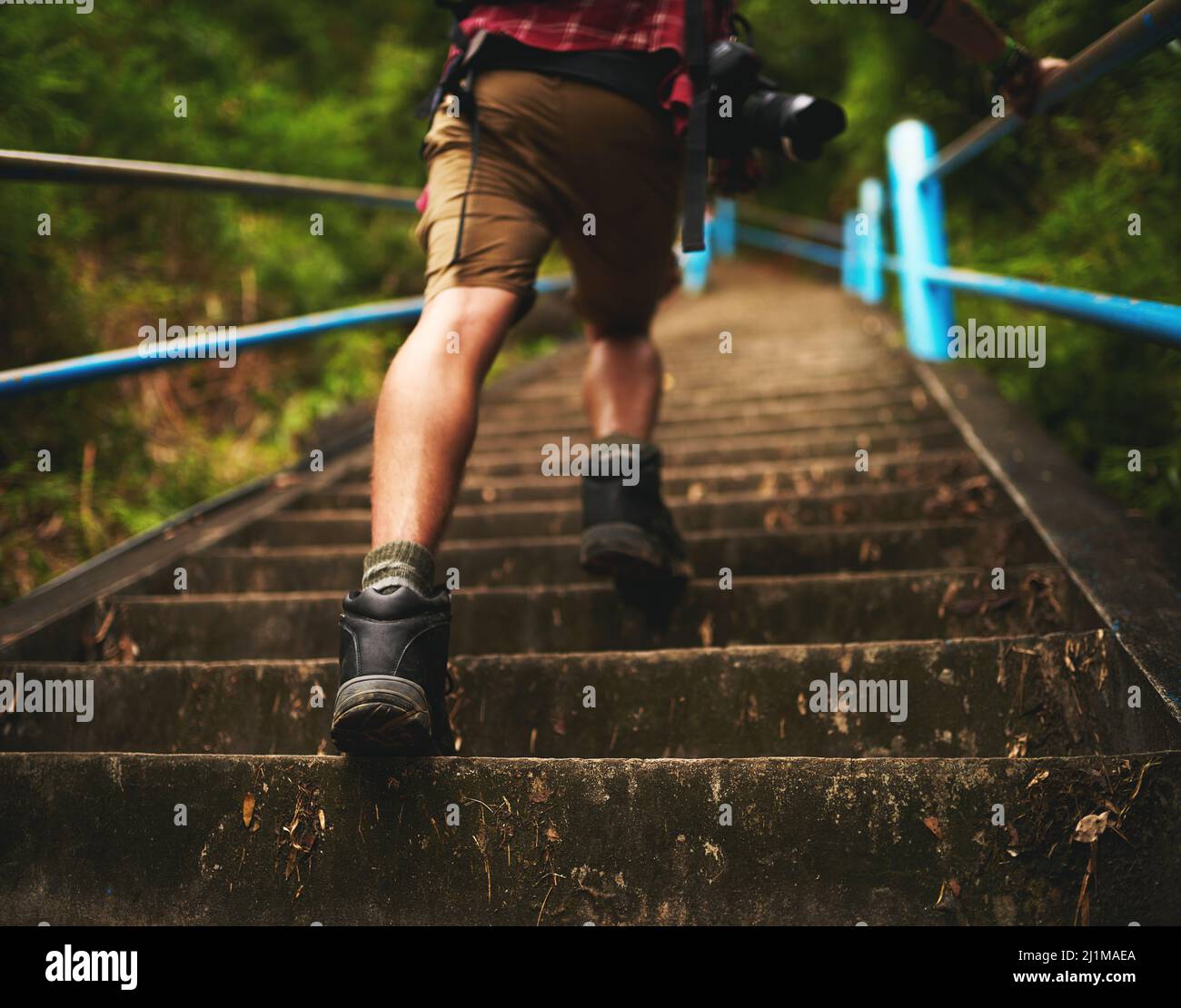 Man climbing stairs hi-res stock photography and images - Alamy