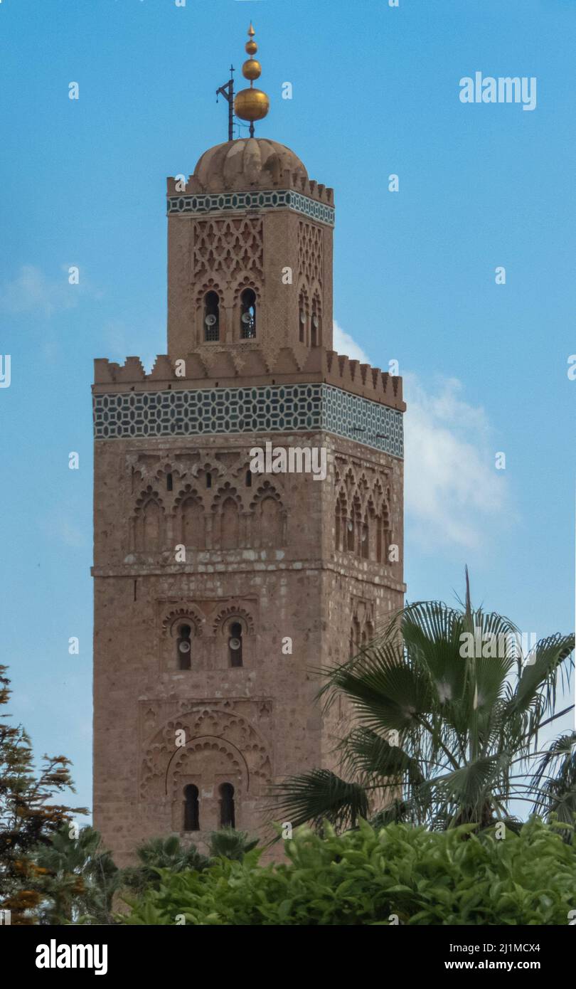 The top half of a stone built minuet with golden balls on the top in an ...