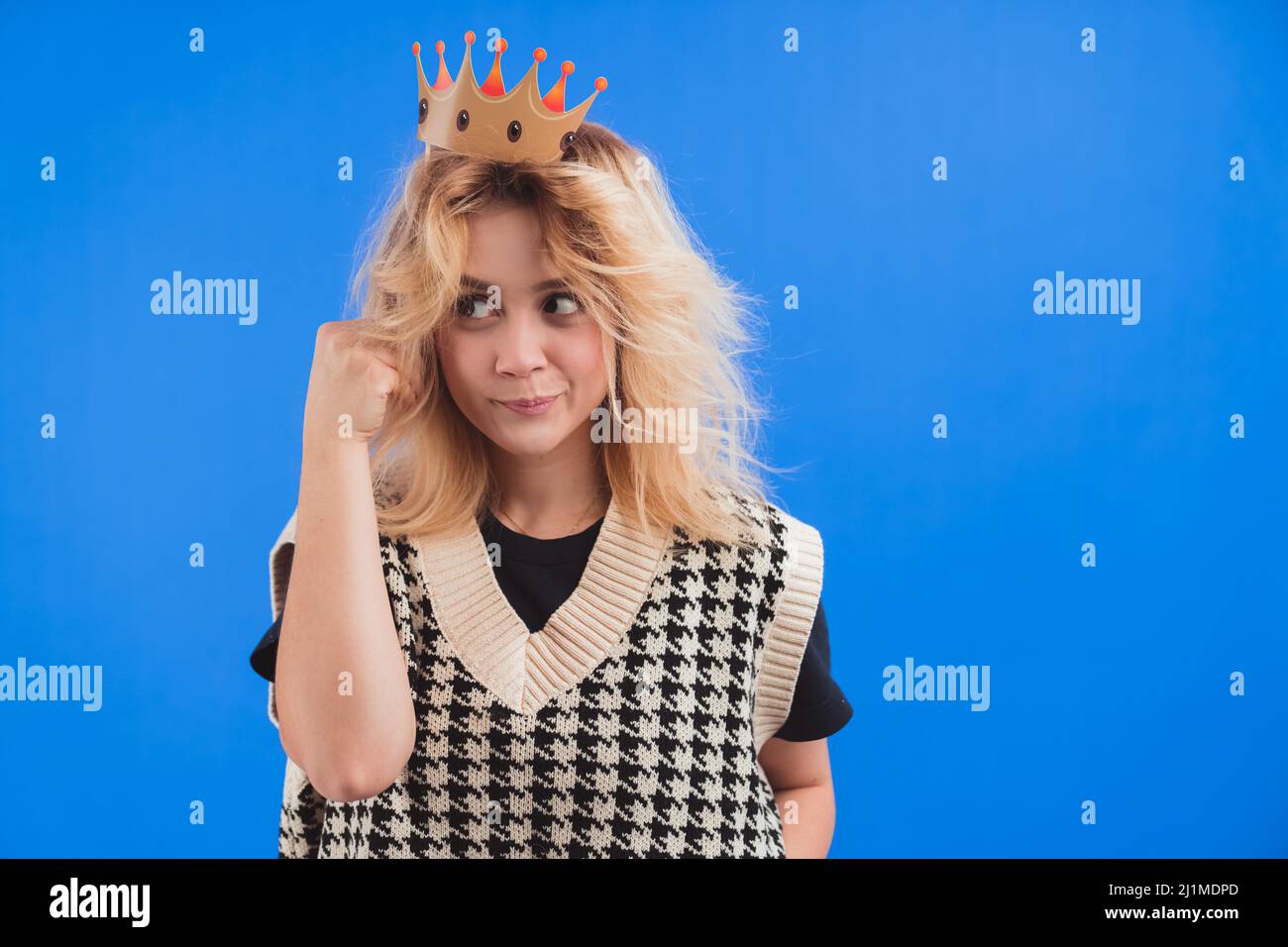 Studio portrait over blue background of funny caucasian millennial girl ...