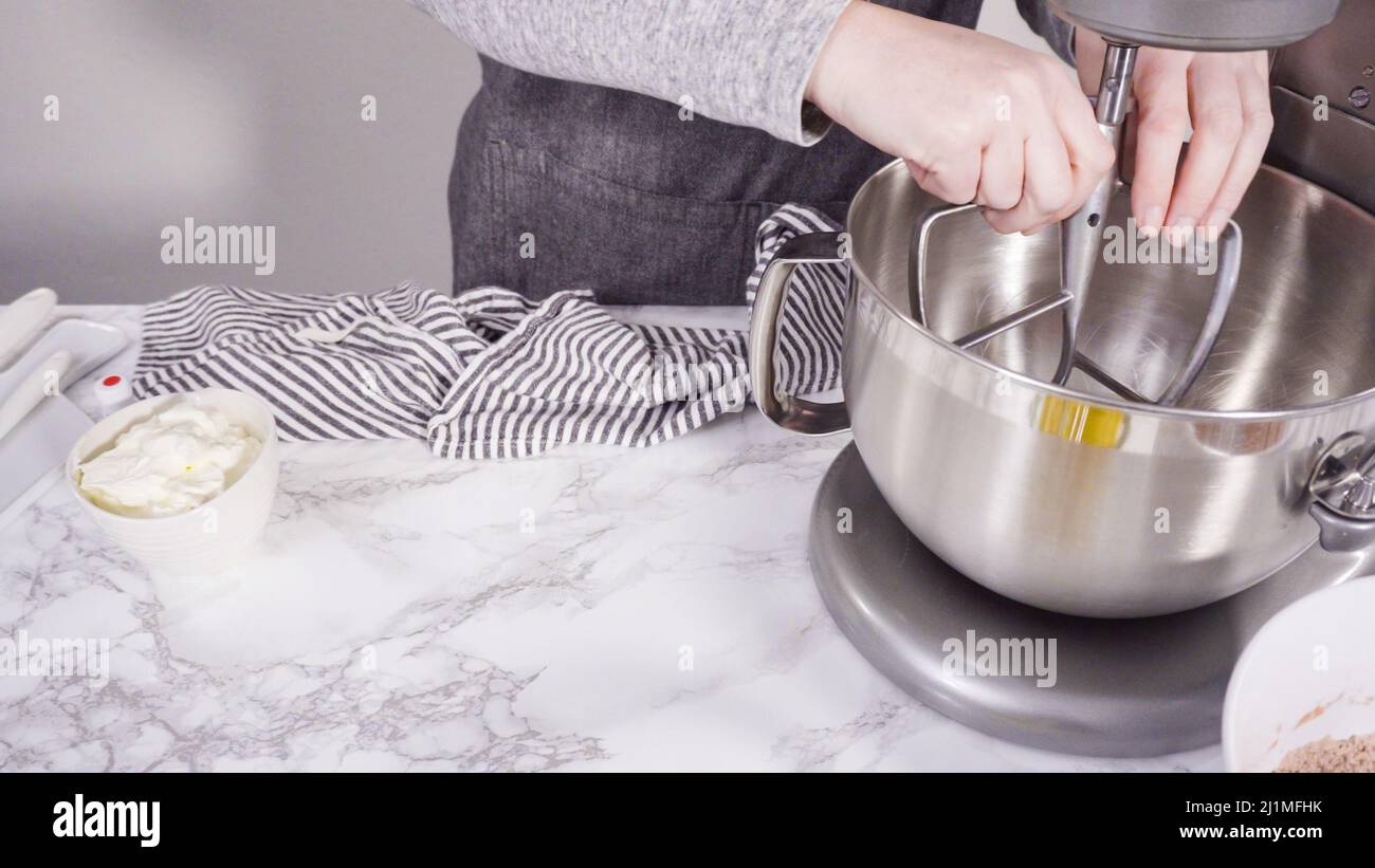 Step by step. Mixing ingredients in a standing kitchen mixer to bake ...