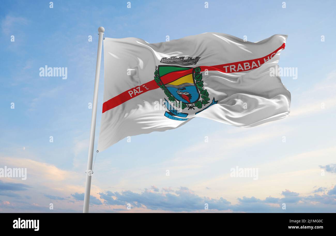 flag of Bento Goncalves , Brazil at cloudy sky background on sunset ...