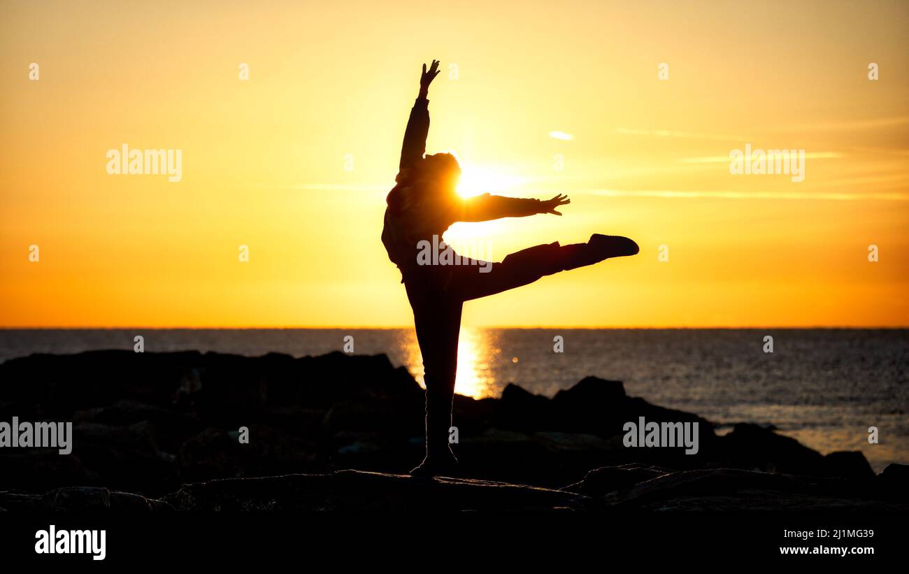 Dancing During Sunrise Stock Photo - Alamy