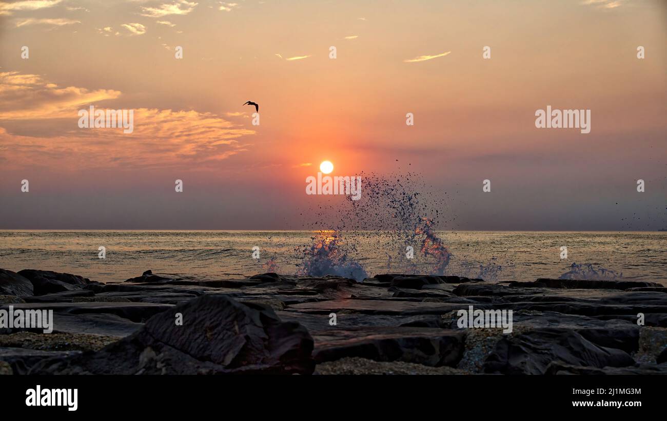Sunrise at the beach with waves hi-res stock photography and images - Alamy