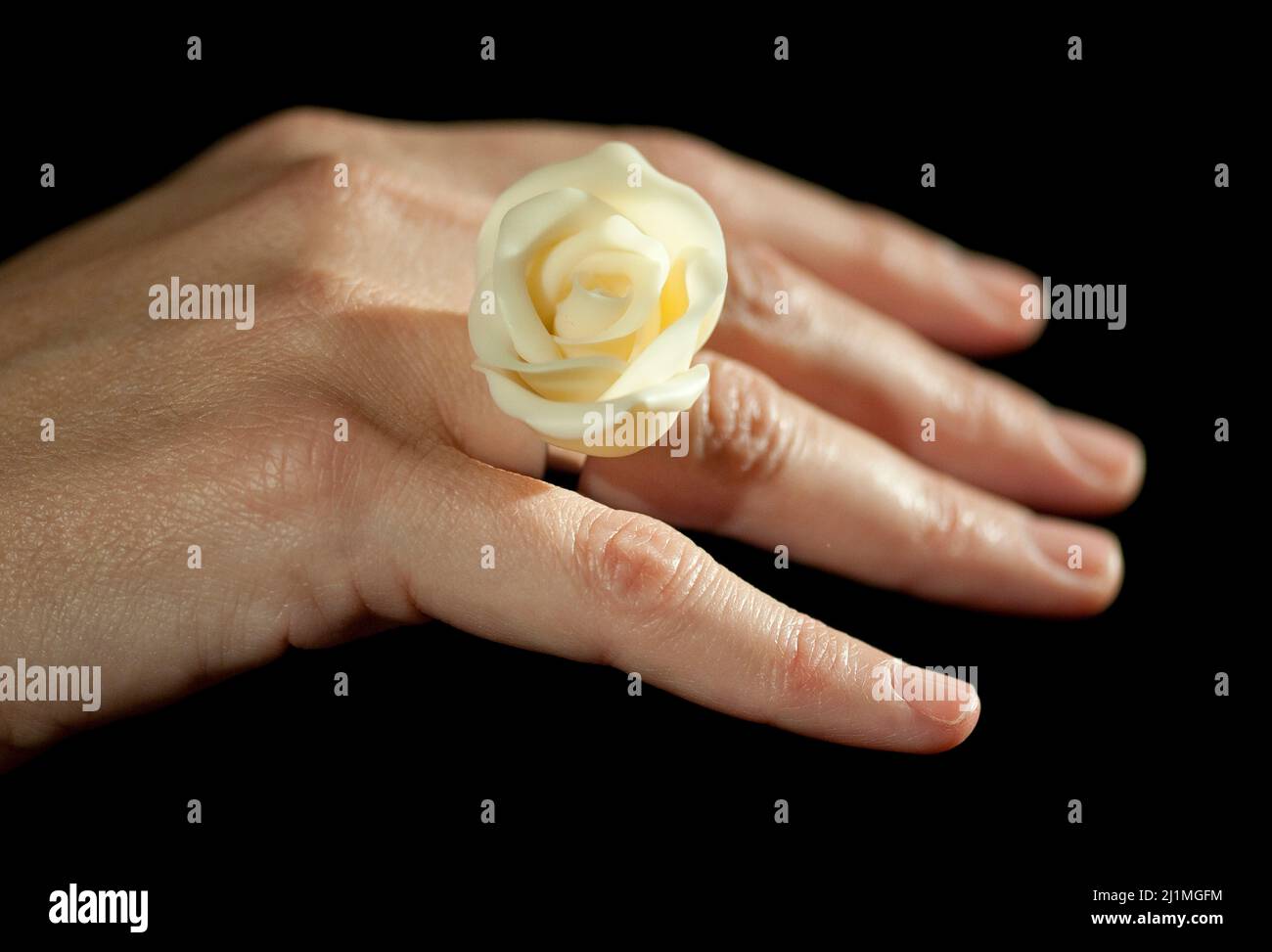 Ceramic Rose on a woman hand Stock Photo - Alamy