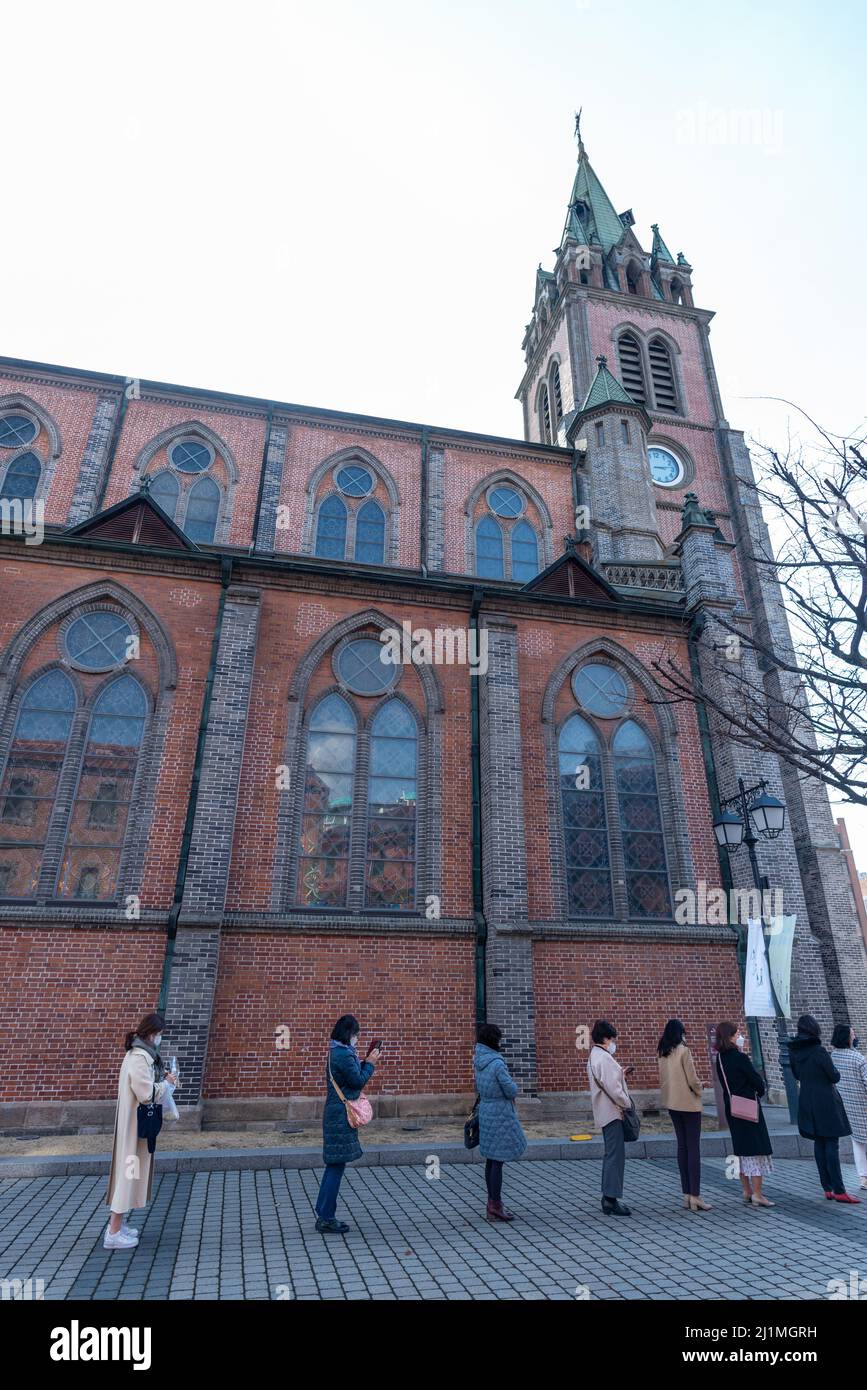 People wait to enter Myeongdong cathedral of the Roman Catholic ...