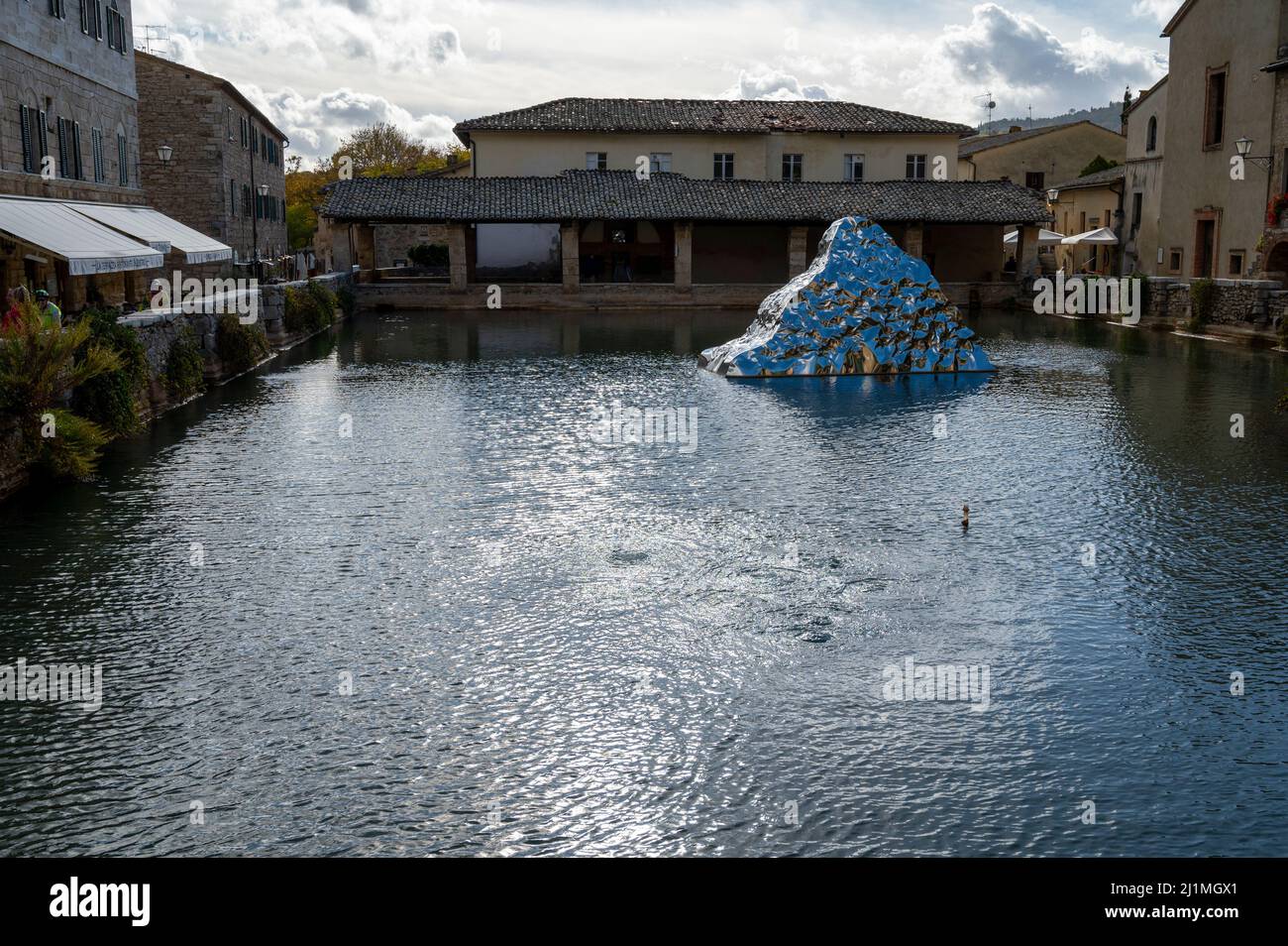 Ancient natural hot springs stone pool in small Italian village Bagno ...