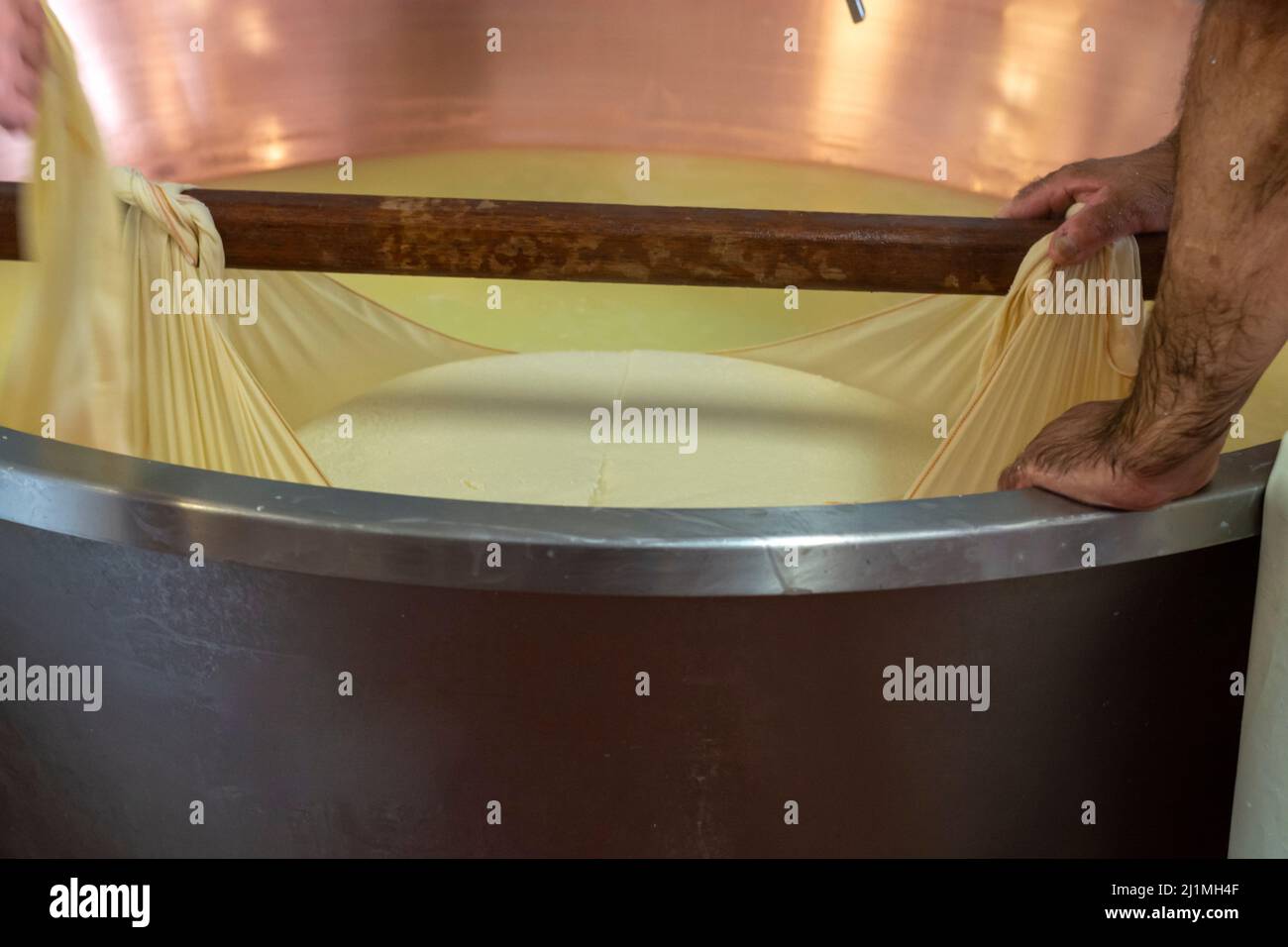 Traditional process of making from cow milk wheels of parmigiano ...
