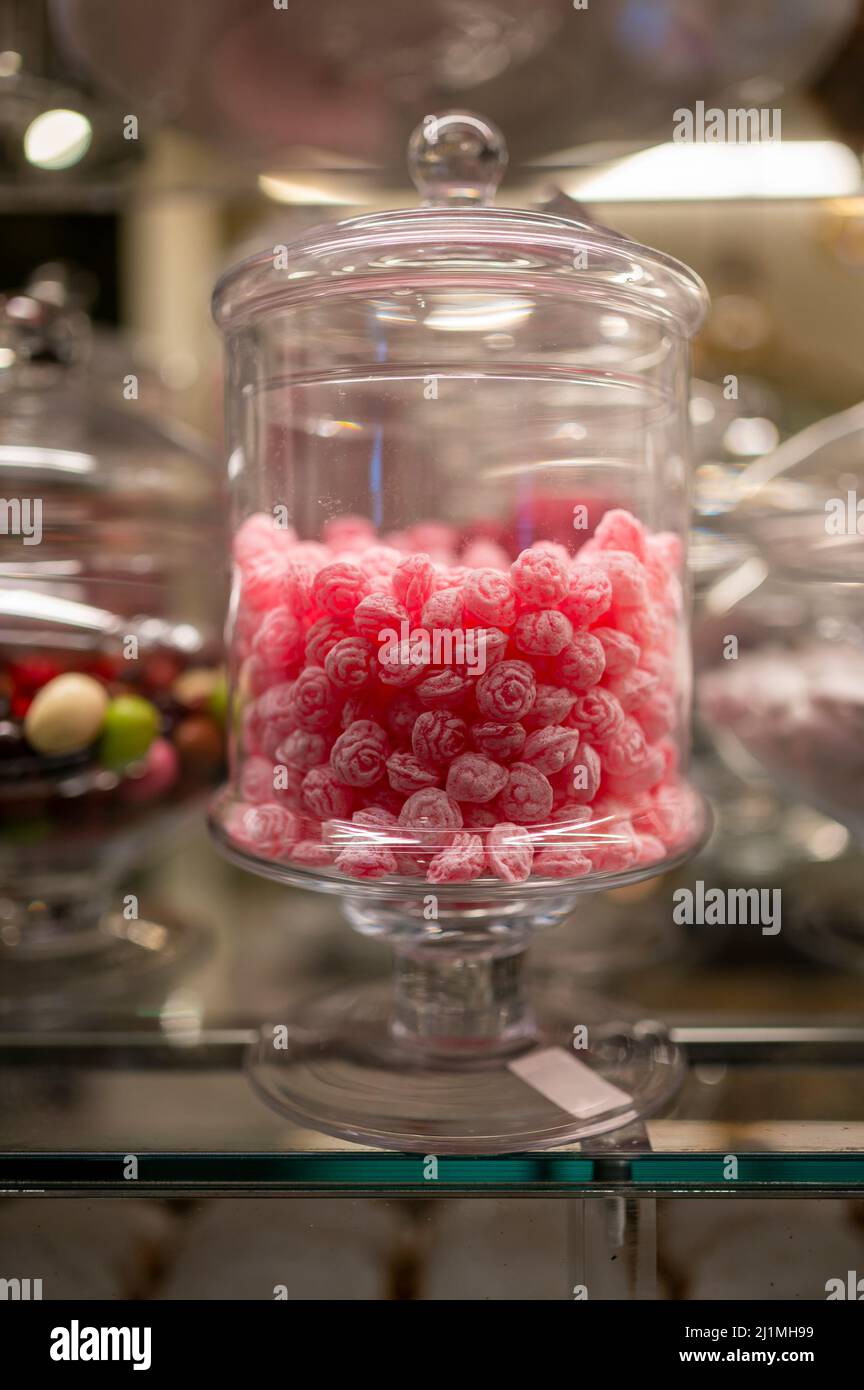 Candy shop display with glass jars filled with jelly candies and ...