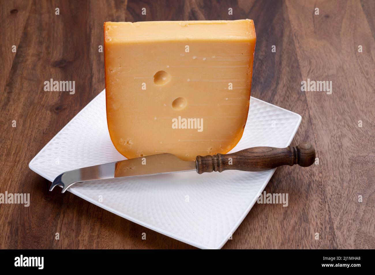 Dutch hard cow milk old yellow cheese from Gouda Stock Photo - Alamy
