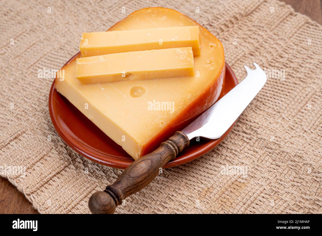 Dutch hard cow milk old yellow cheese from Gouda Stock Photo - Alamy