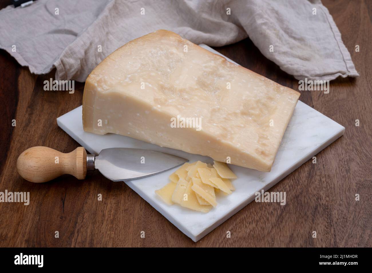 Flakes of parmesan cheese, italian hard parmigiano-reggiano cheese from ...