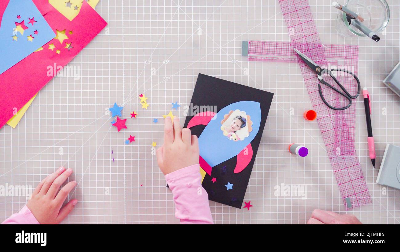 Flat lay. Little girl making a handmade Father's Day card from ...