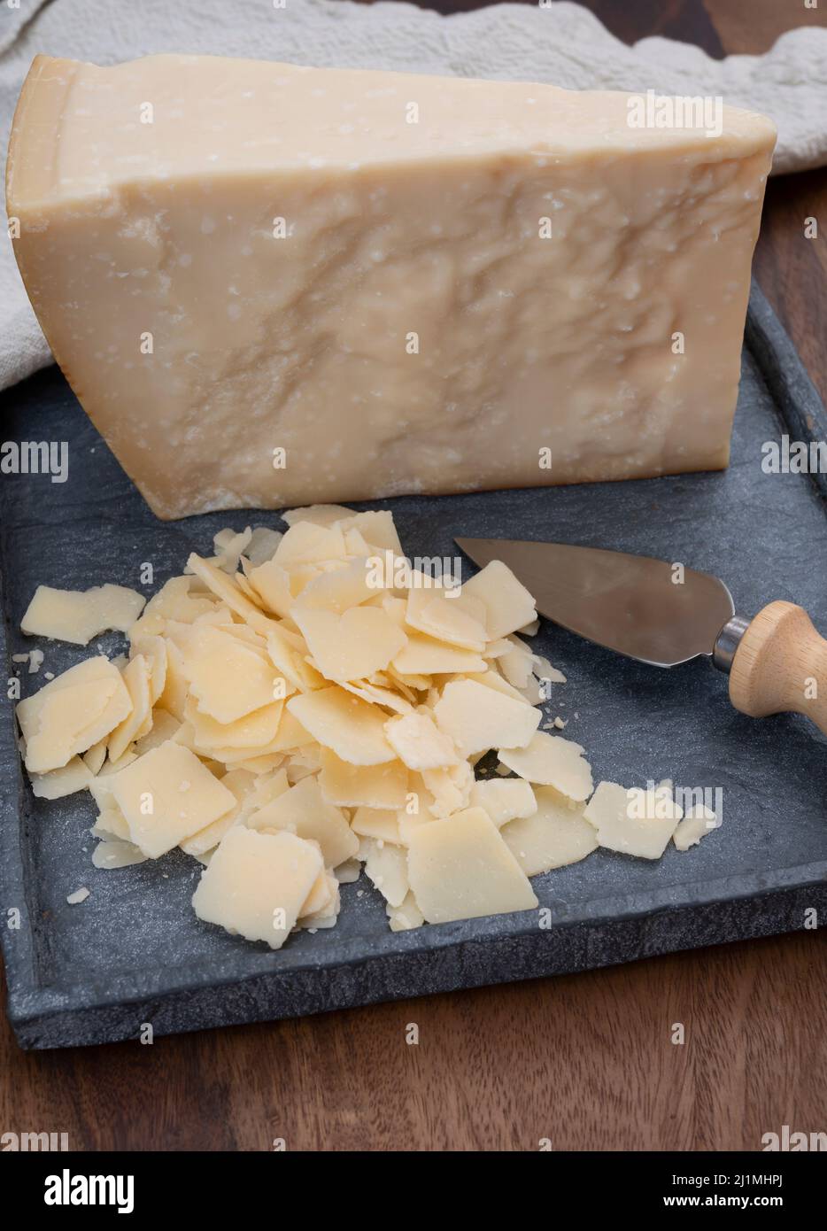 Flakes of parmesan cheese, italian hard parmigiano-reggiano cheese from ...