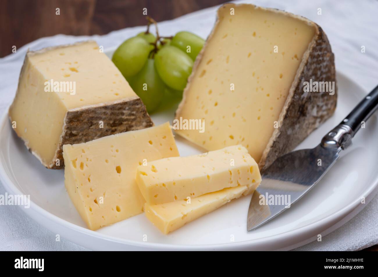 French mountain cheese from Alps, tomme de Savoie, close up Stock Photo ...