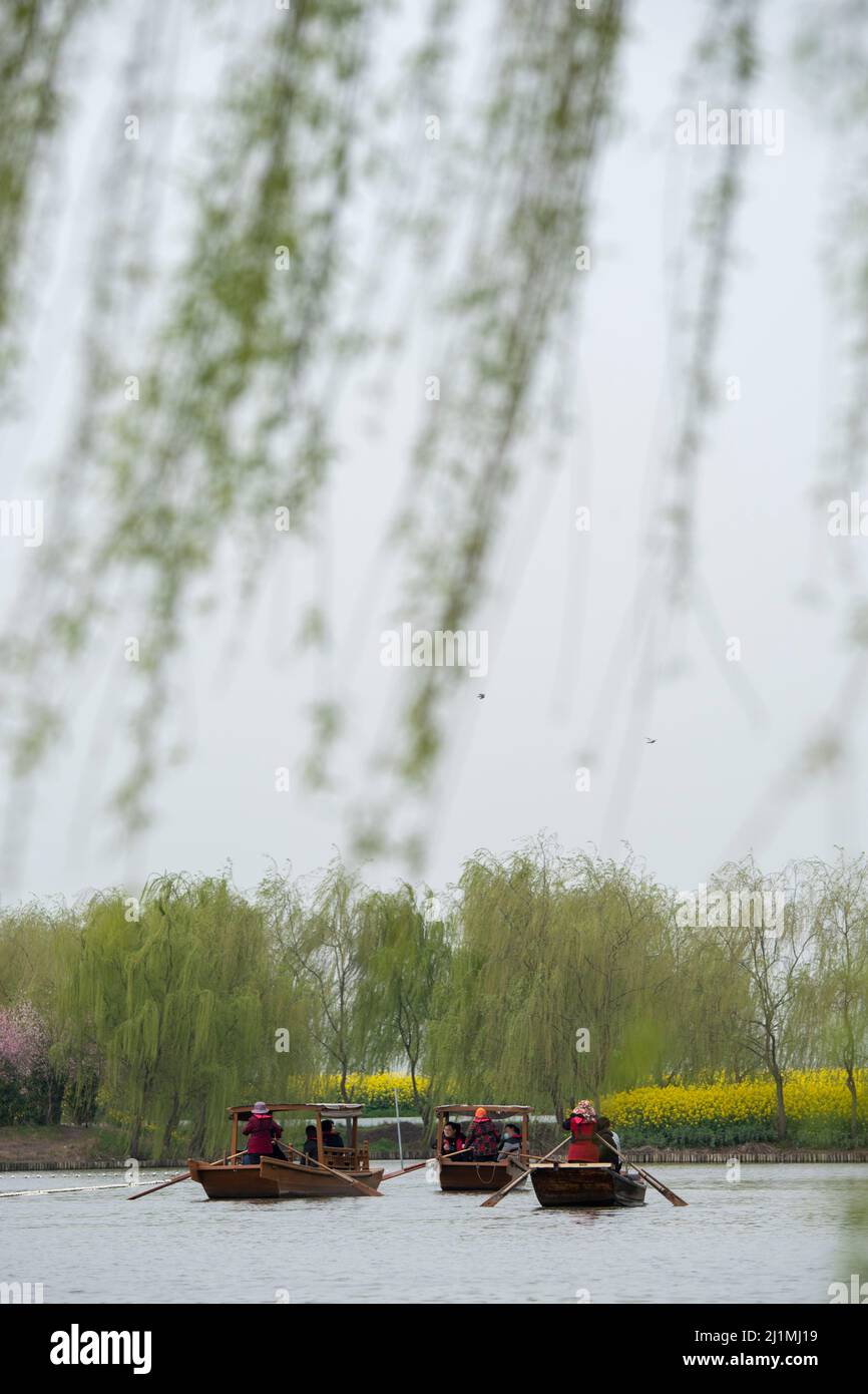 HAIAN, CHINA - MARCH 26, 2022 - Tourists take boats at Xibo Tourist ...