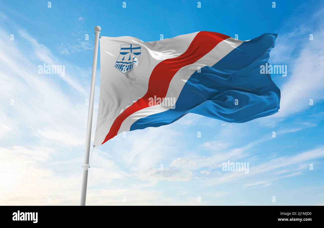 flag of St Albert, Alberta , Canada at cloudy sky background on sunset ...