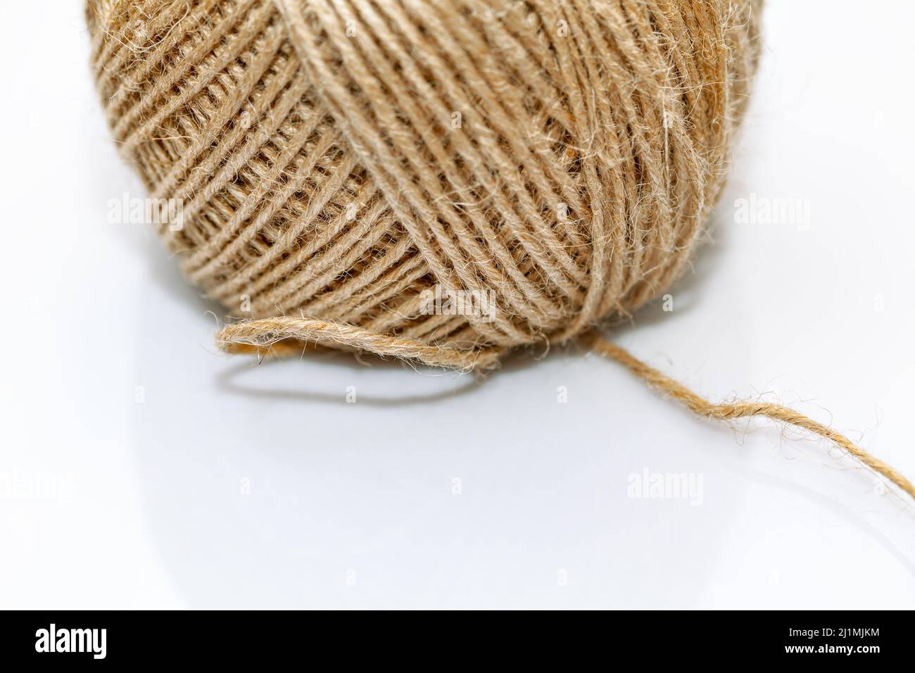 Skein Of Thread at white background Stock Photo - Alamy