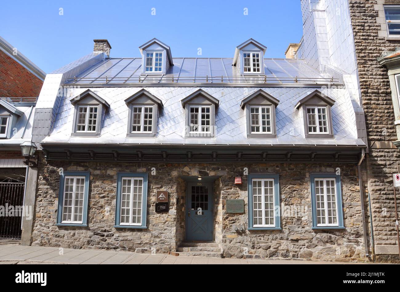 French style historic commercial building on 86 Rue Saint-Louis Street ...