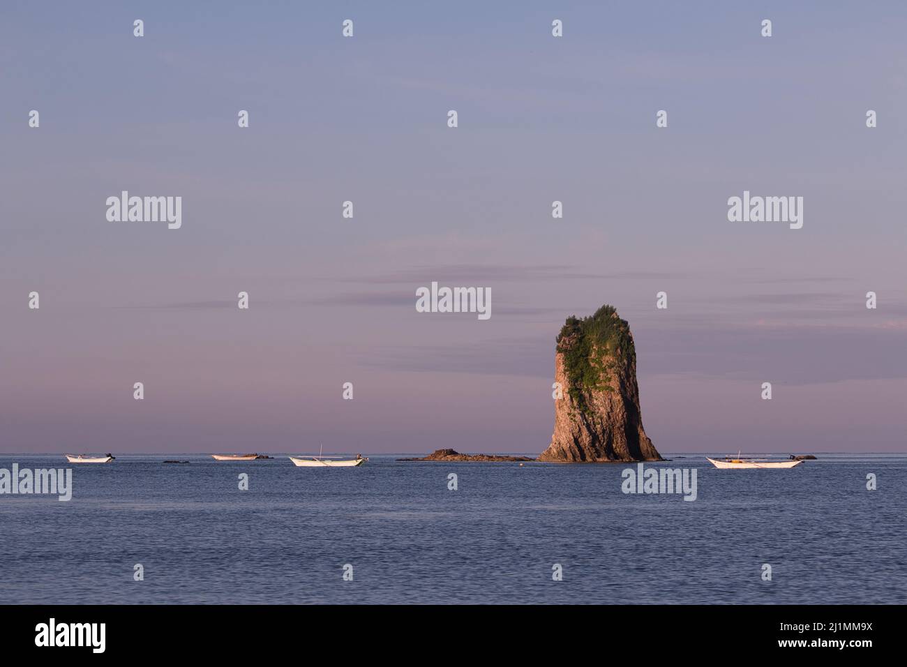 Four sea urchin fishing boats at sea in the early morning Stock Photo ...