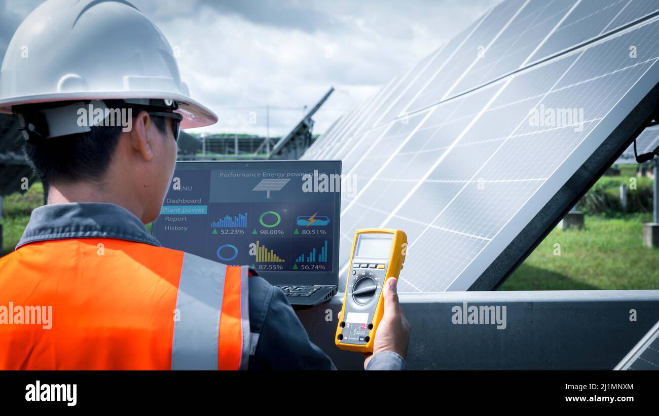 The solar farm(solar panel) with engineers check the operation of the ...