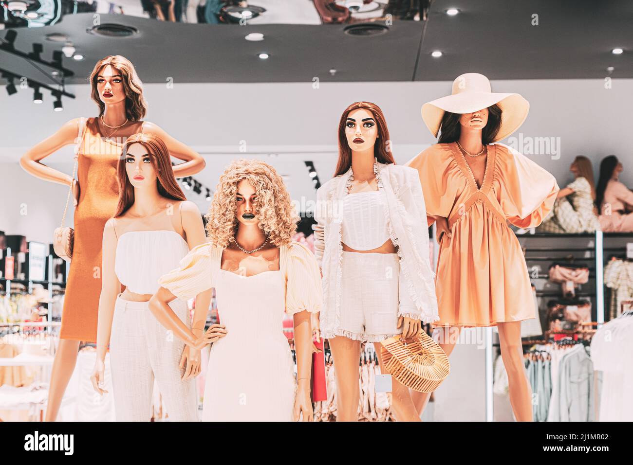 Female mannequin in store mall market. Mannequins dressed in female ...