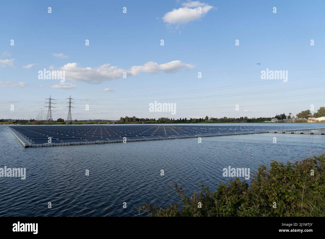 Solar panel farm on a fish pond for electricity generation Stock Photo ...