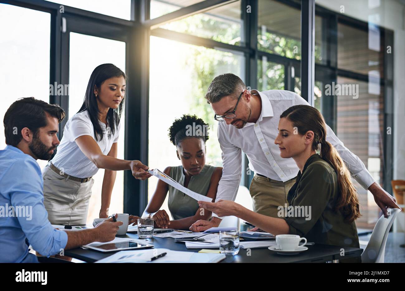 They always do great work together. Shot of a group of businesspeople ...
