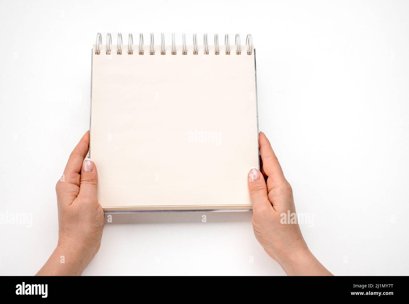 Notepad mockup. female hands holding blank spiral notepad or calendar ...