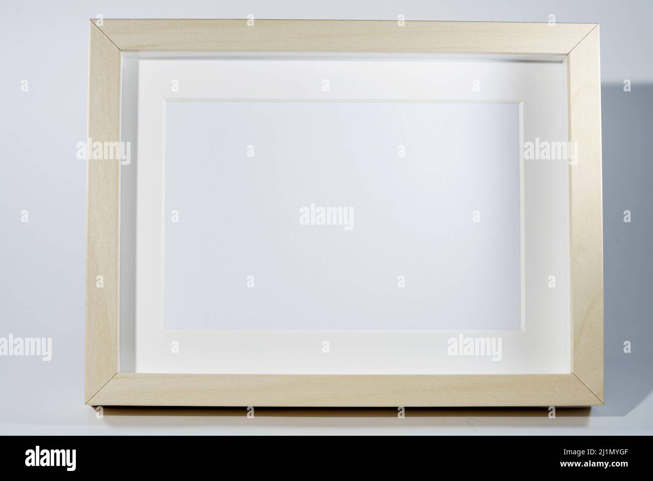 An empty cream colored picture frame on a white background Stock Photo ...