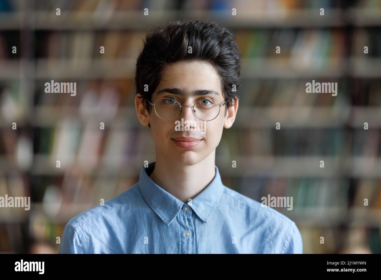 Head shot portrait student guy in glasses posing in library Stock Photo ...