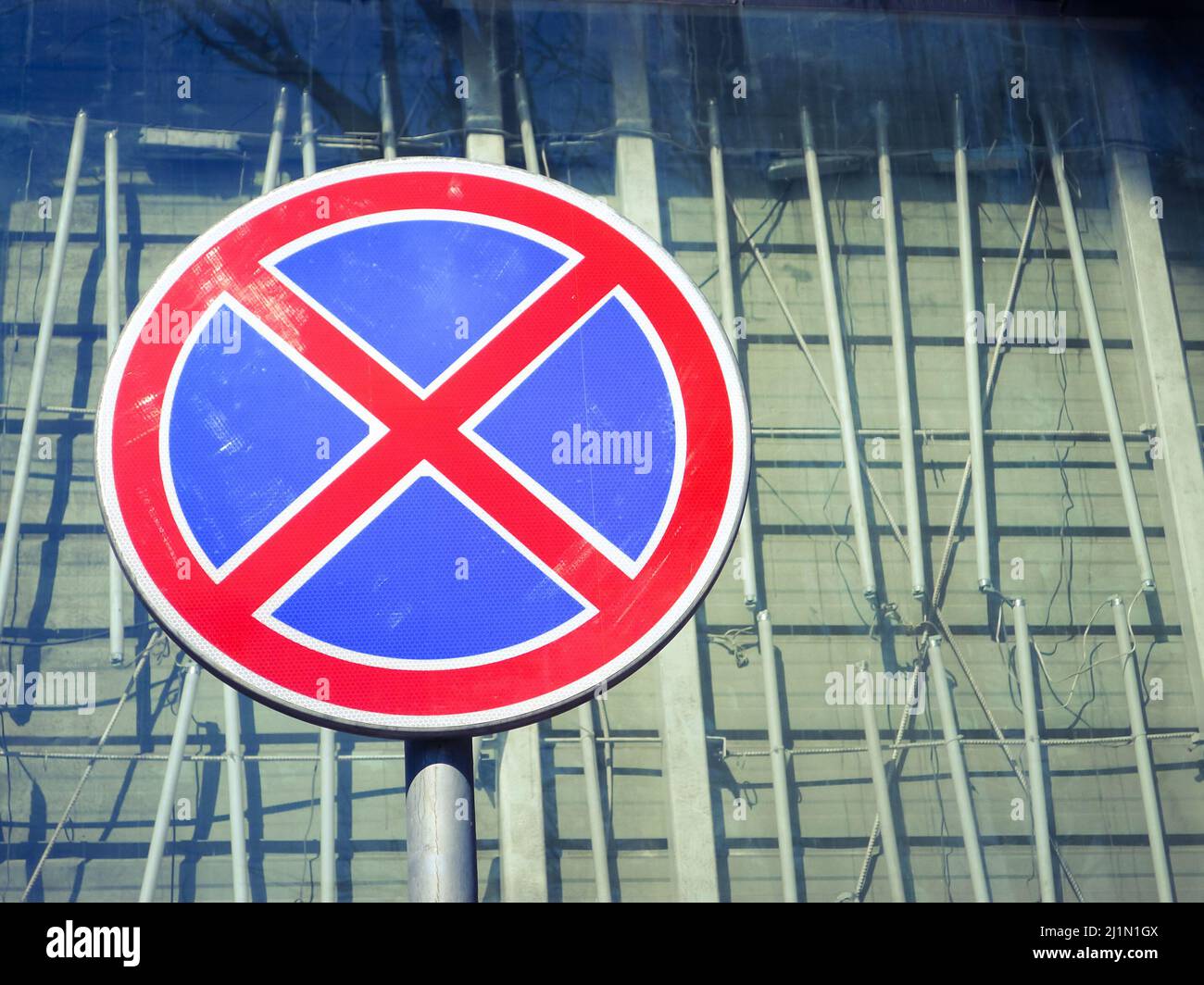 Red and blue regulation sign in the street Stock Photo - Alamy