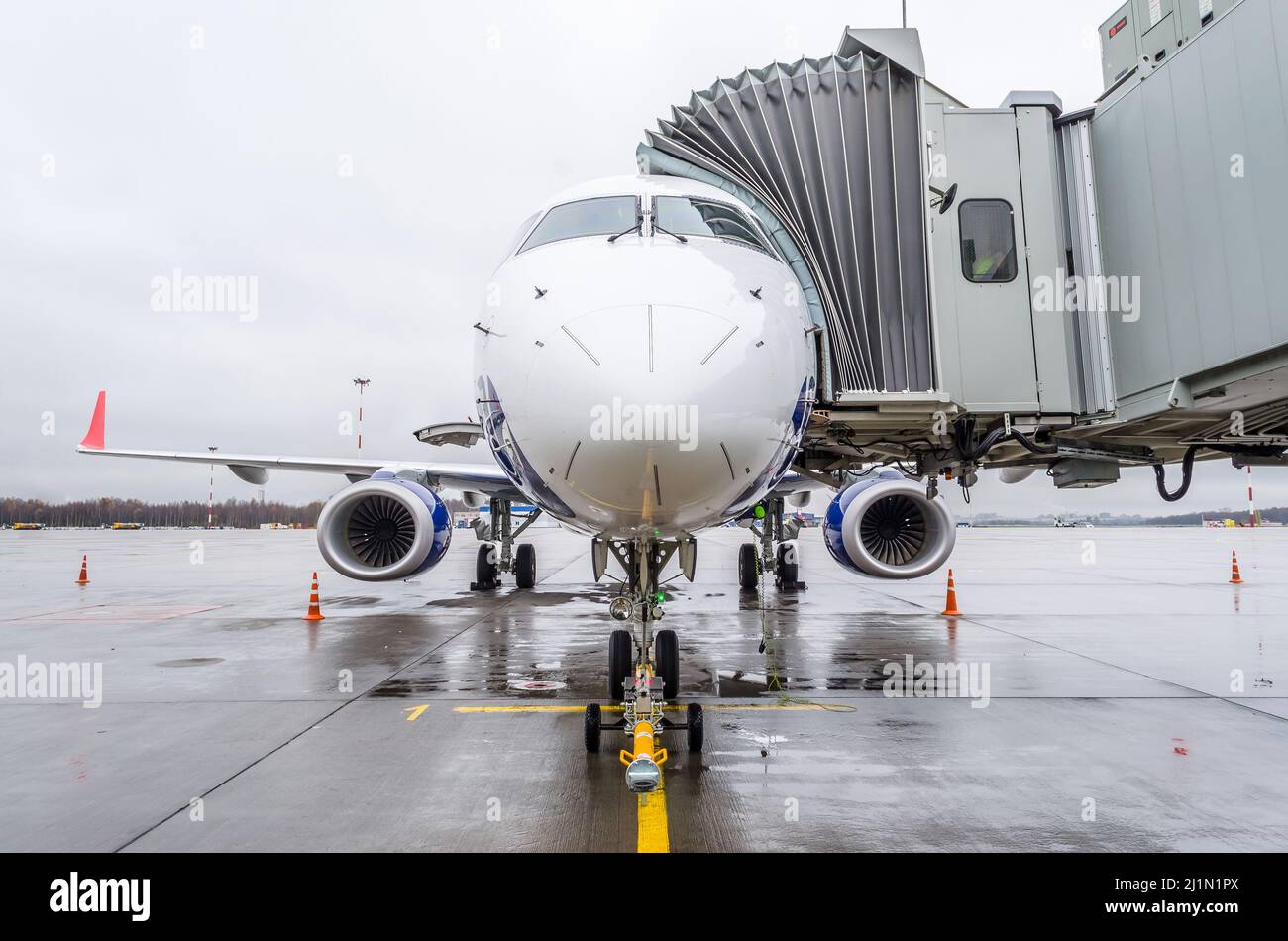 Airplane is parked at the airport with a gangway waiting for boarding ...