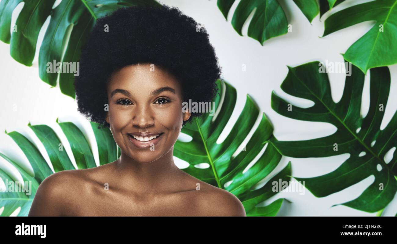 Young and beautiful African woman with perfect smooth skin in tropical ...
