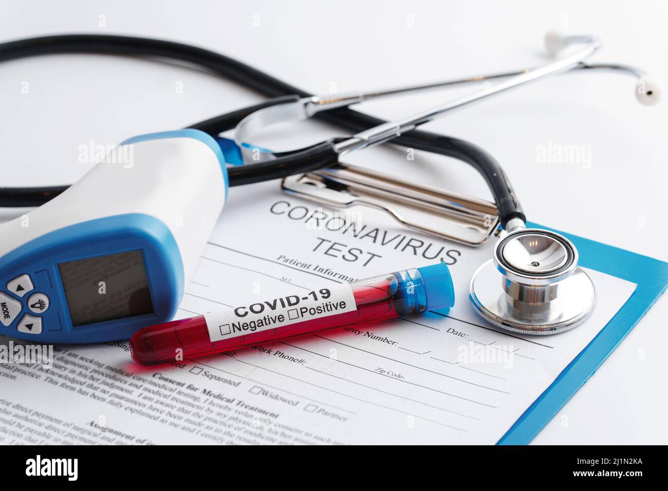 Blood samples, stethoscope and digital infrared thermometer Stock Photo ...