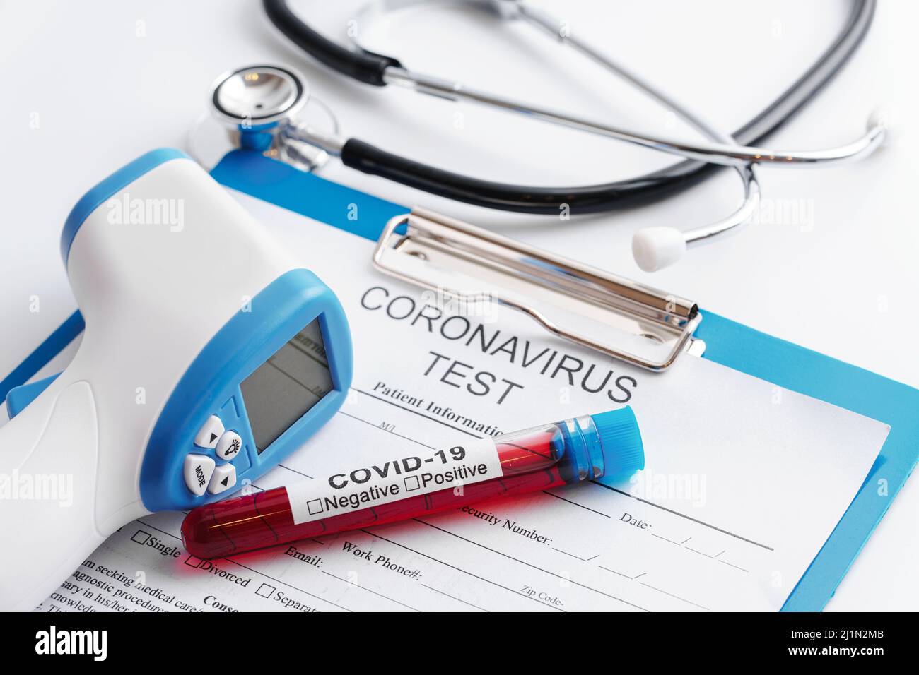 Blood samples, stethoscope and digital infrared thermometer Stock Photo ...