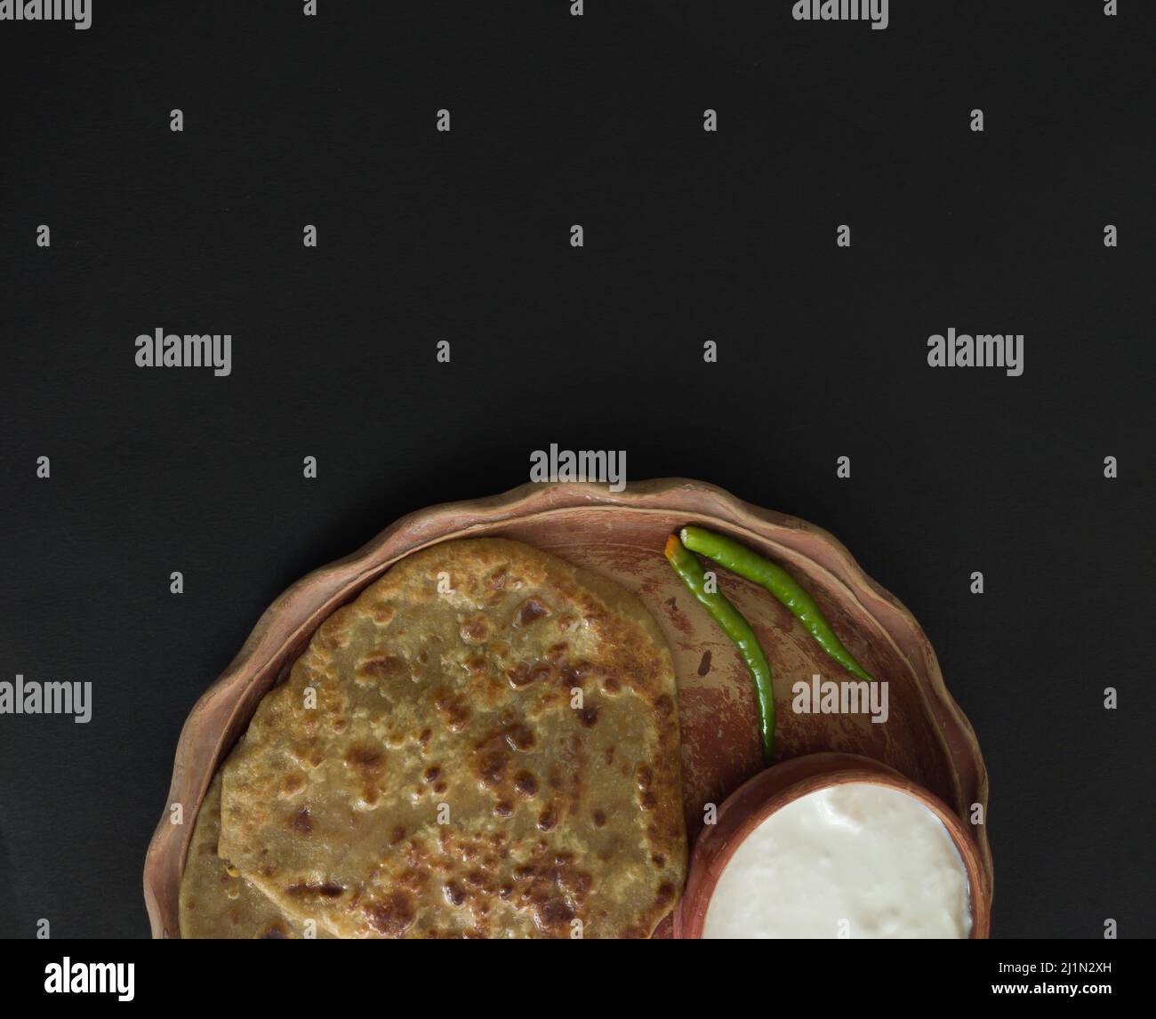 aloo paratha with curd served on plate. Traditional north indian food ...