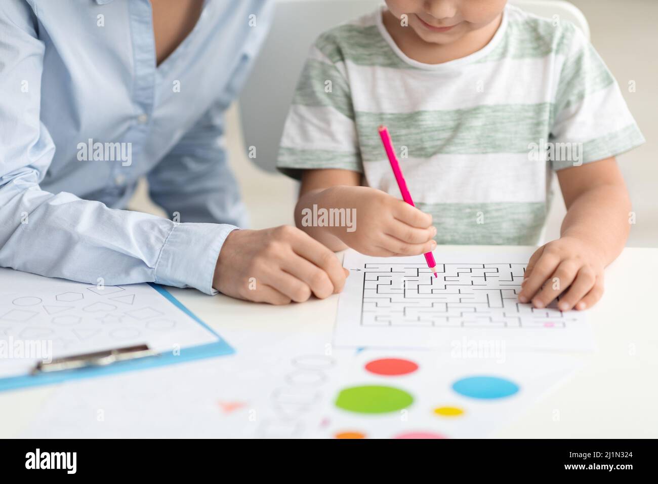 Logical kids development. Close up of little boy exercising with ...