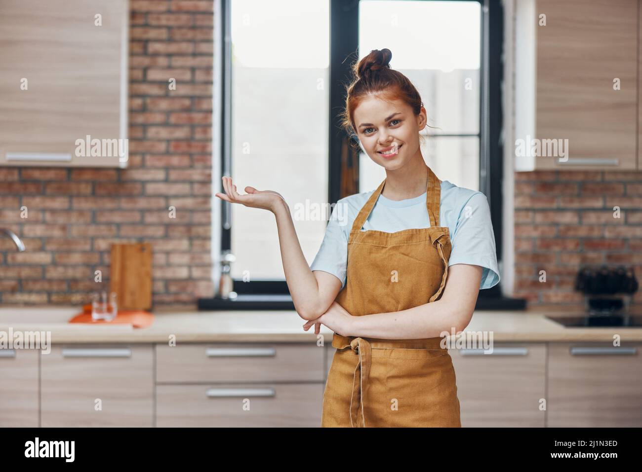 woman houses in the kitchen gestures with his hands apartments ...