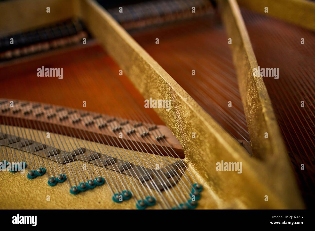 Close-up image of grand piano showing strings and structure, musical ...